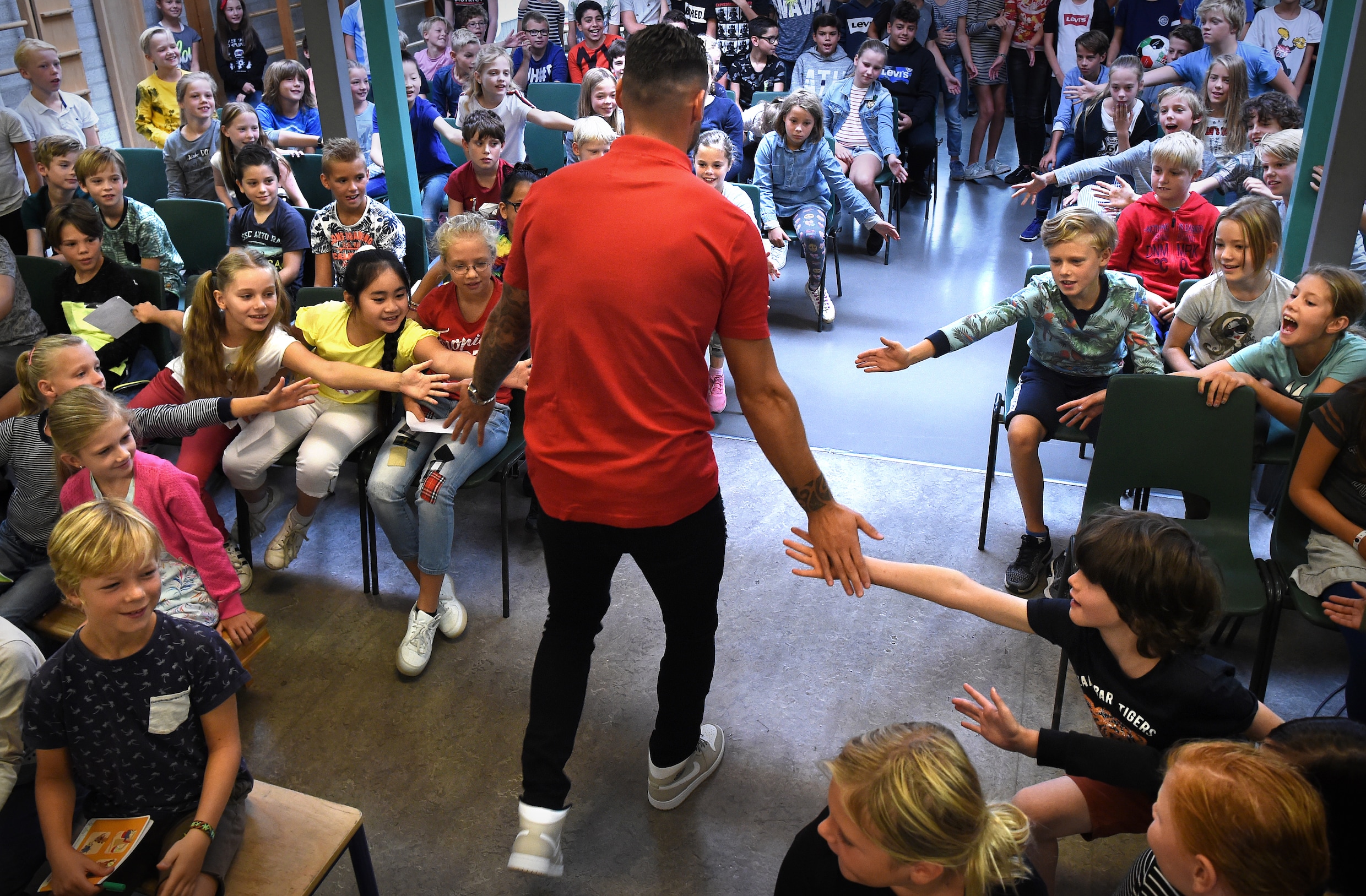 Een kerk, een ijssalon en nu een basisschool: NEC presenteert zijn ...